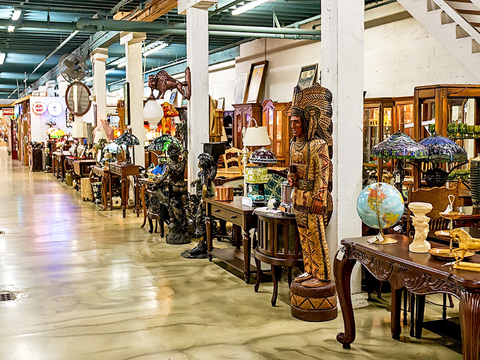 A treasure hunter's paradise where every aisle tells a story. The wooden Native American figure stands guard over decades of memories waiting to be adopted.