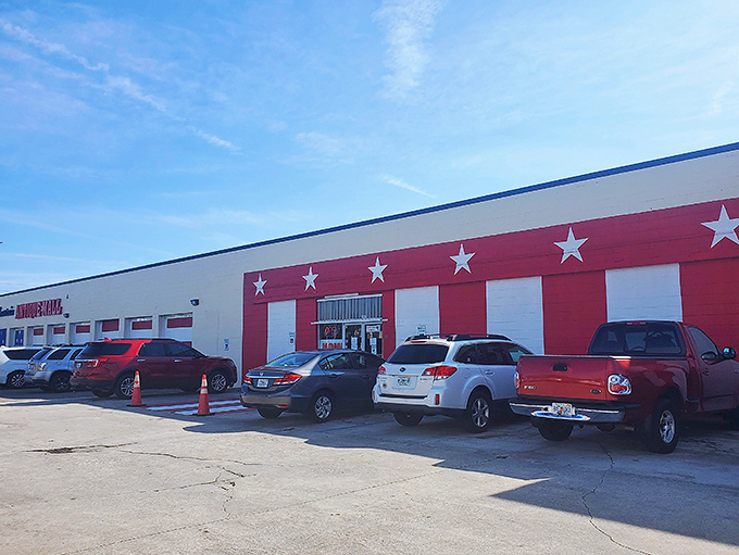 The patriotic red and white exterior of America's Antique Mall stands like a treasure chest waiting to be opened, complete with stars that promise all-American nostalgia inside.