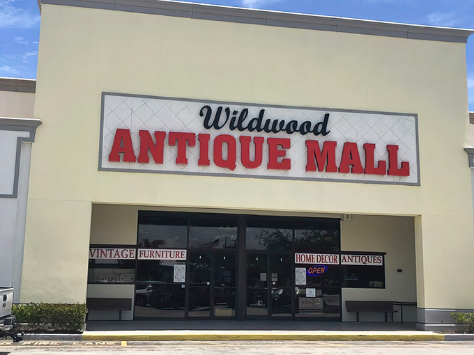 The unassuming exterior of Wildwood Antique Mall belies the wonderland of vintage treasures waiting inside, like a time-travel portal disguised as a strip mall storefront.