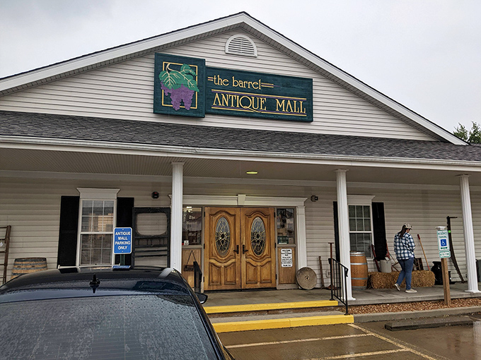 The welcoming facade of The Barrel Antique Mall beckons with its charming wooden doors and country-style porch. Time travel begins here!