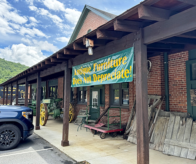 The brick facade of Whistle Stop Shop Depot proudly announces its philosophy with a bright banner: "Antique Furniture Does Not Depreciate!" A treasure hunter's first clue.