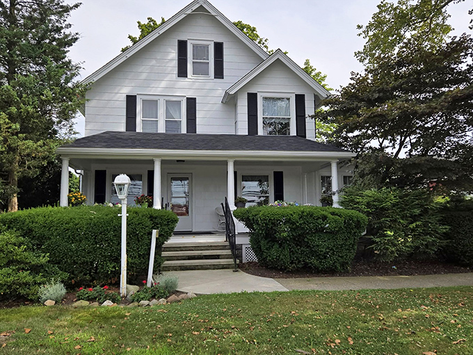 The classic white farmhouse exterior of Jameson Homestead Antiques invites you in like a warm hug from the past. History never looked so homey!