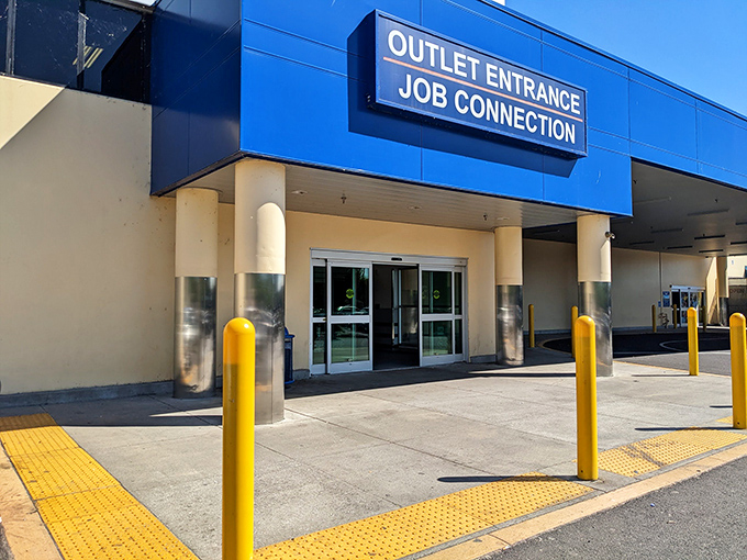The blue and cream exterior beckons like a portal to treasure-hunting paradise. Yellow safety poles stand guard, protecting the thrill that awaits inside.