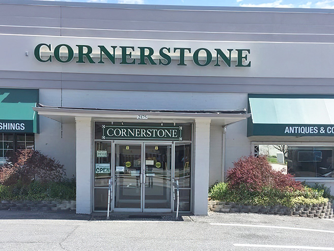 The unassuming exterior hides a treasure trove within. Those elegant stone planters are just the first hint of the wonders awaiting inside.