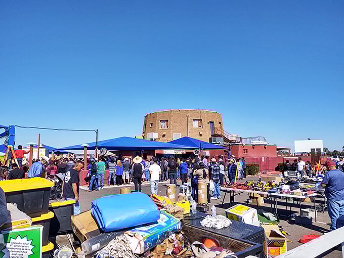 The distinctive round building serves as the market's landmark, standing like a desert fortress amid a sea of colorful vendor tents and treasure hunters.