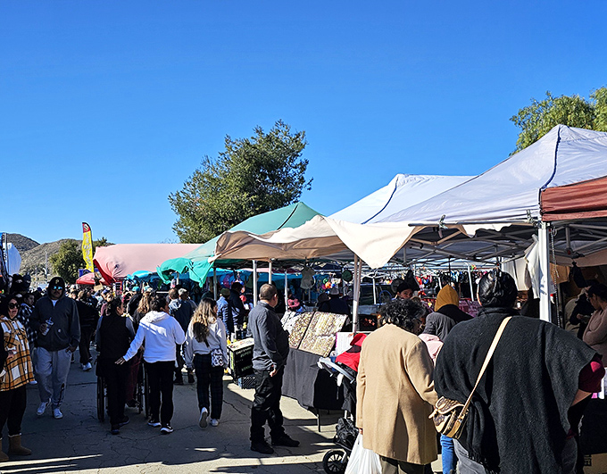 Blue skies and bargains stretch as far as the eye can see. Winchester's treasure hunters navigate this asphalt wonderland like seasoned explorers.