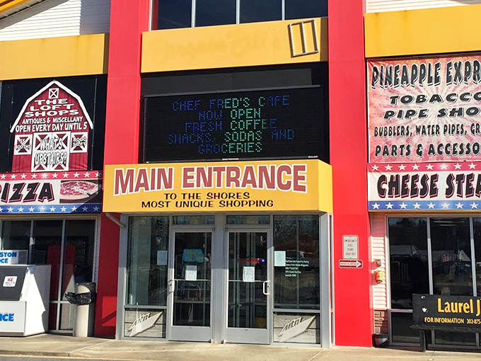 The vibrant red and yellow exterior of Laurel Junction Flea Market stands like a beacon for treasure hunters, promising adventures in bargain paradise.