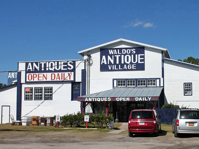 The white and blue facade of Waldo's Antique Village stands like a beacon for treasure hunters. Open daily, it promises discoveries that big box stores can't deliver.