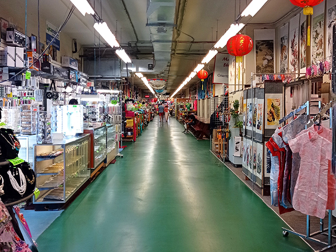 The iconic green-floored corridors of Main Gate Flea Market stretch like a bargain hunter's yellow brick road, promising treasures at every turn.