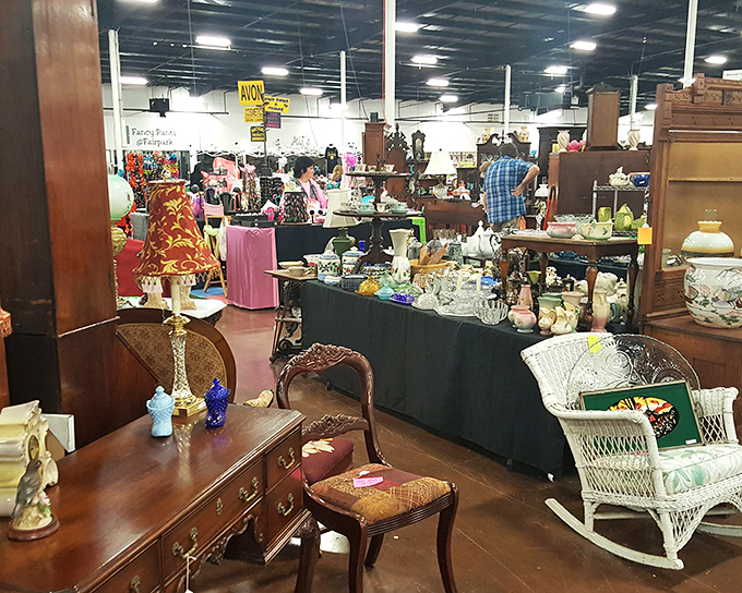 Treasure hunting paradise! Antique furniture mingles with collectibles under industrial lighting, creating the perfect backdrop for your next great find.