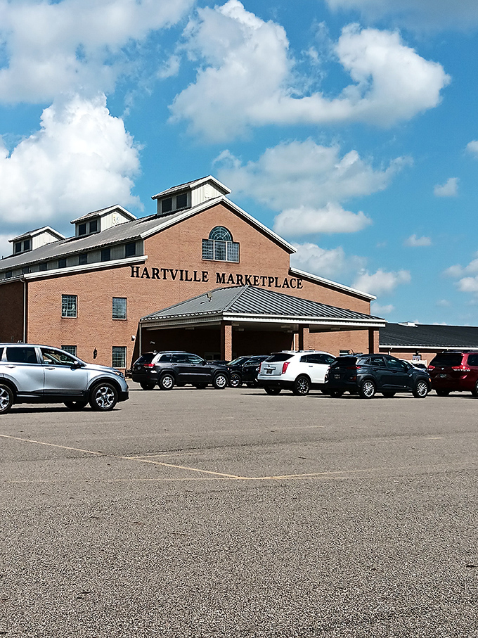 The brick facade of Hartville MarketPlace stands like a retail cathedral against Ohio's blue sky, promising treasures within for the patient explorer.