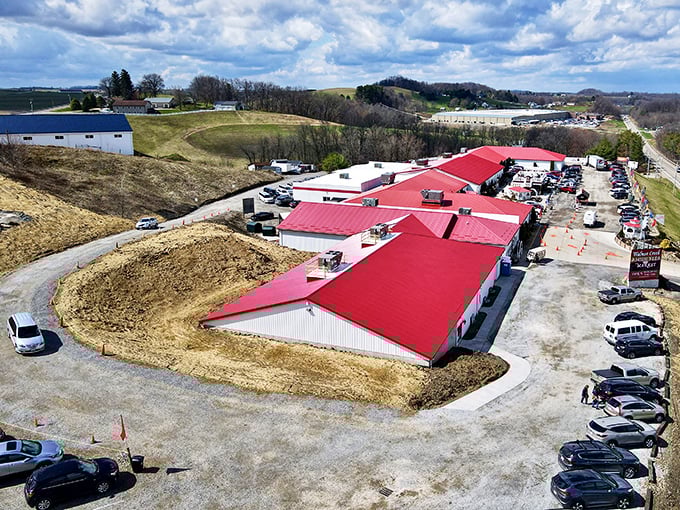 The iconic windmill sign welcomes bargain hunters to Walnut Creek Marketplace, where Amish Country charm meets treasure-hunting paradise under Ohio's big blue sky.