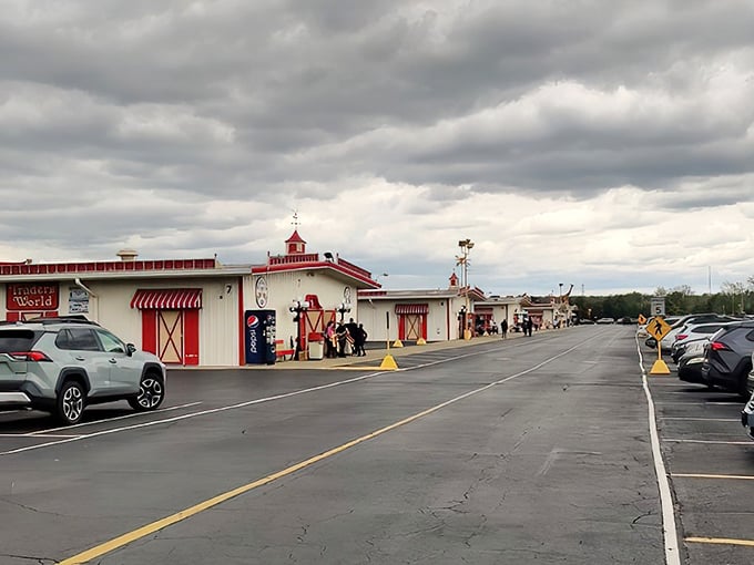 The iconic red-trimmed buildings of Traders World stand ready to welcome treasure hunters under Ohio skies. Bargain paradise awaits!