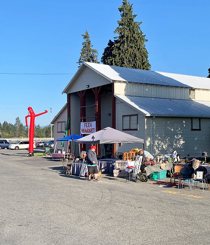 The Southern Oregon Flea Market welcomes treasure hunters with its unassuming exterior and that iconic red inflatable tube man dancing in the breeze. Treasure awaits!