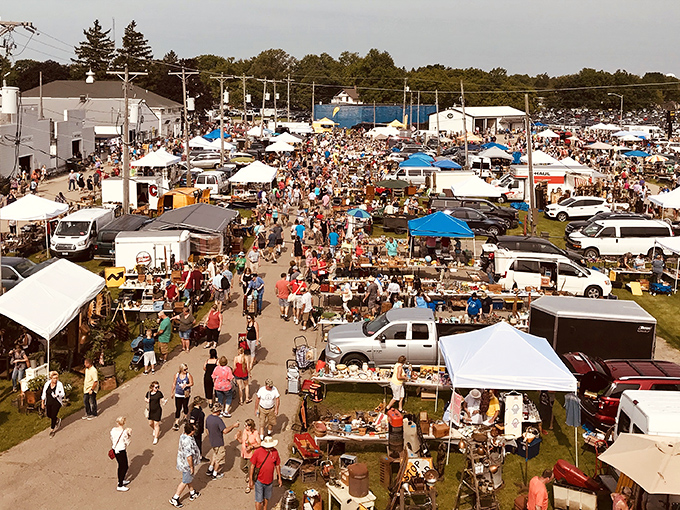 A treasure hunter's paradise stretches as far as the eye can see, with a repurposed school bus serving as the ultimate vintage vendor outpost.