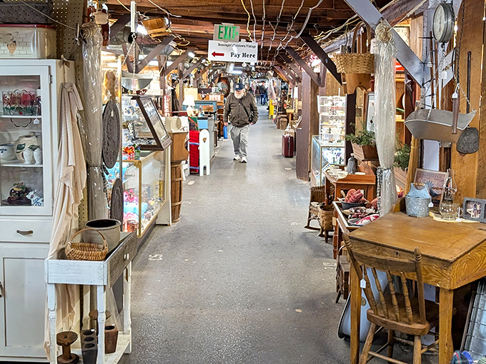 Treasure hunters gather under rustic beams where one person's forgotten relic becomes another's perfect find.