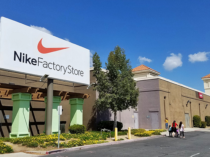 The Nike Factory Store stands like a retail lighthouse, beckoning bargain hunters with promises of sneakers at prices that won't make your wallet weep.