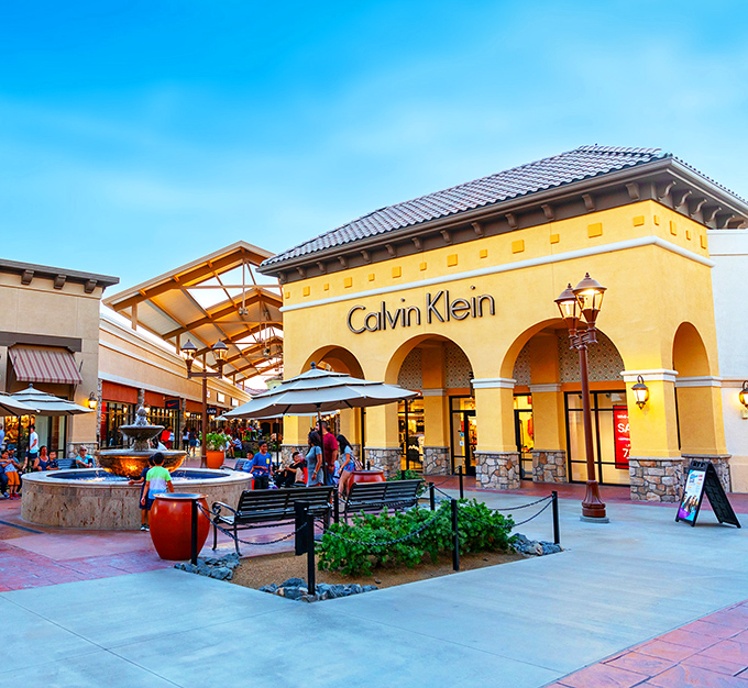 That towering beacon signals retail salvation awaits, where Columbia Sportswear and other brands gather like old friends at a shopping reunion.