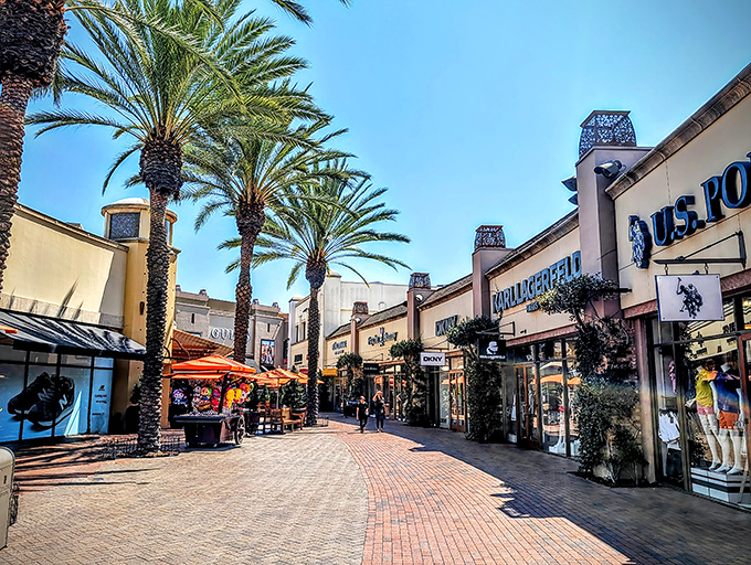Palm trees line the brick walkways of Citadel Outlets, where shopping feels like strolling through a Mediterranean village with American brand names.