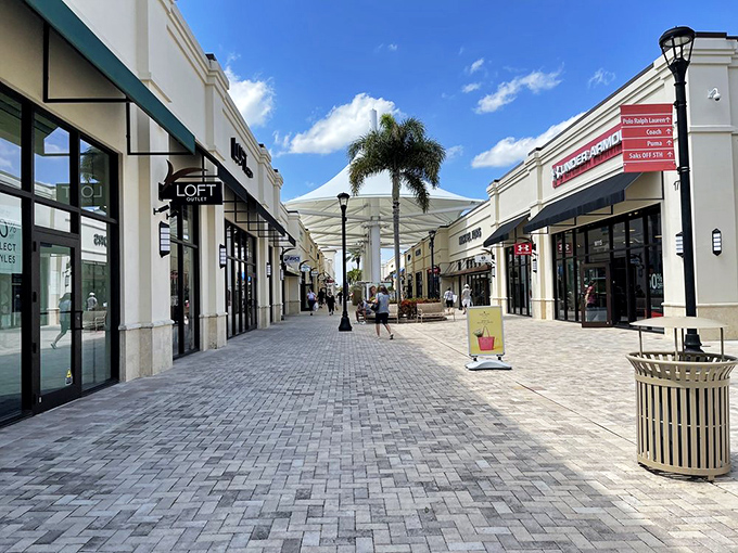 The pristine walkways of Tanger Outlets Palm Beach invite shoppers to stroll in Florida sunshine while hunting for designer deals.