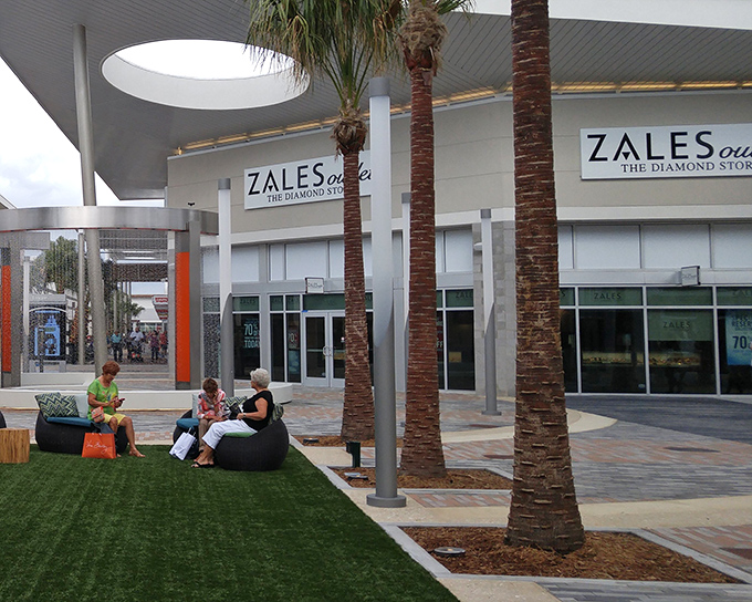 Look at those shoppers relaxing on artificial turf &ndash; they've discovered the secret to outlet marathon training.