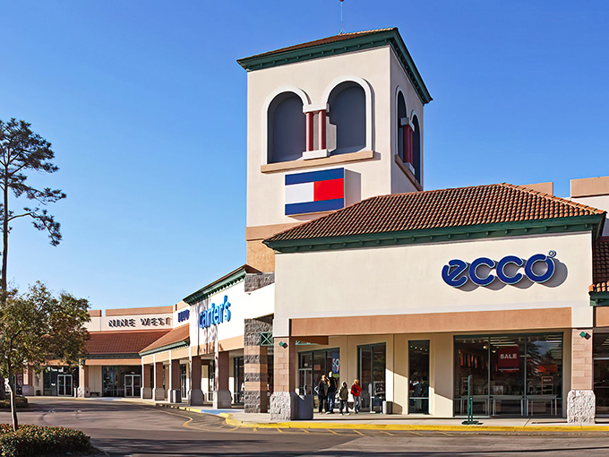 The iconic tower of St. Augustine Premium Outlets stands like a beacon for bargain hunters, promising treasures within those Mediterranean-inspired walls.