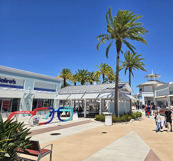 Retail therapy gets the Florida treatment with swaying palms, bright blue skies, and storefronts that look more resort than outlet mall.