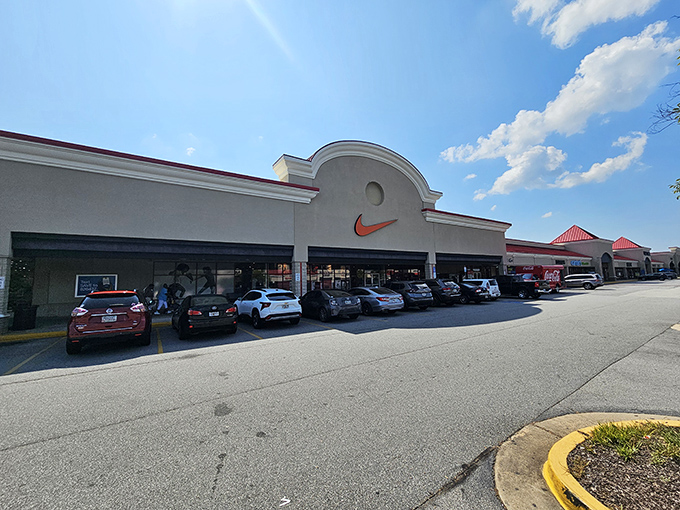 The iconic Nike storefront welcomes bargain hunters with its signature swoosh, promising athletic wear that won't make your wallet break a sweat.