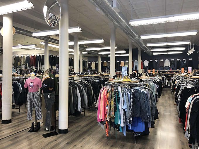 The navy blue storefront with orange-trimmed windows stands like a fashion oasis on Market Street, beckoning style-seekers with promises of hidden treasures inside.