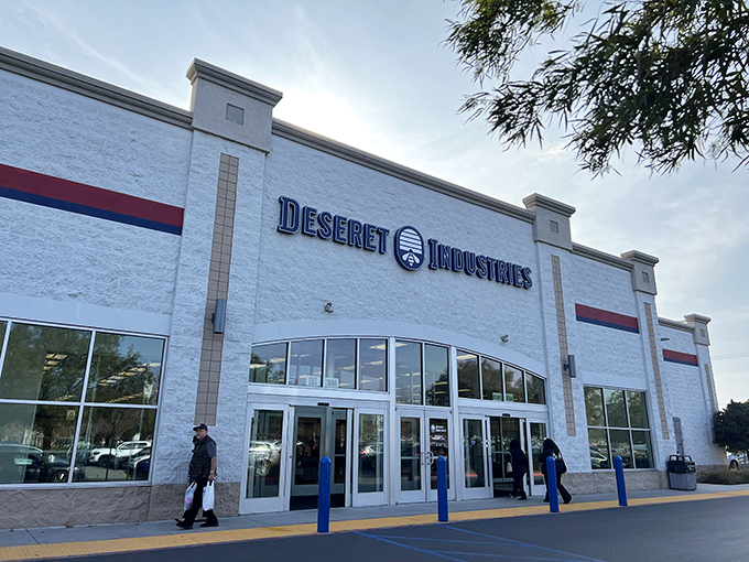 The white facade of Deseret Industries stands like a beacon of budget-friendly hope, promising treasures within that won't break the bank.