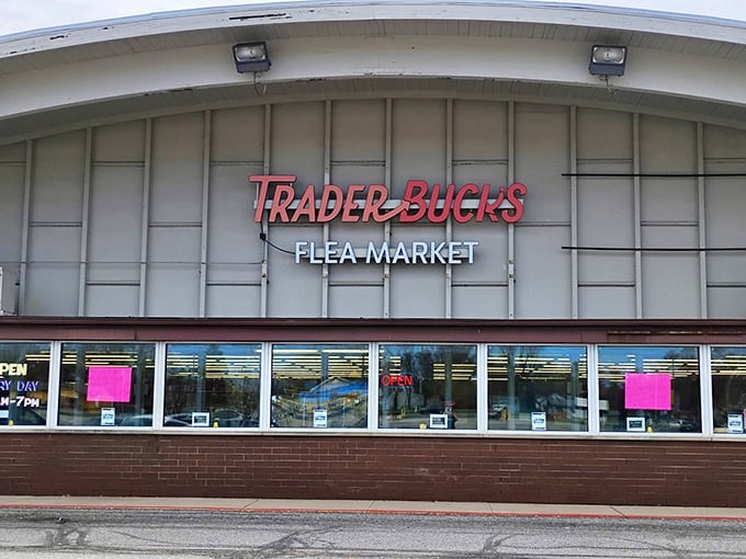 The iconic red and white sign of Trader Buck's beckons bargain hunters like a retail lighthouse, promising treasures within this unassuming Merrillville landmark.