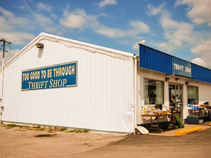 The unassuming exterior of Too Good To Be Through beckons like a siren song to bargain hunters. White walls, blue trim, and endless possibilities await inside.