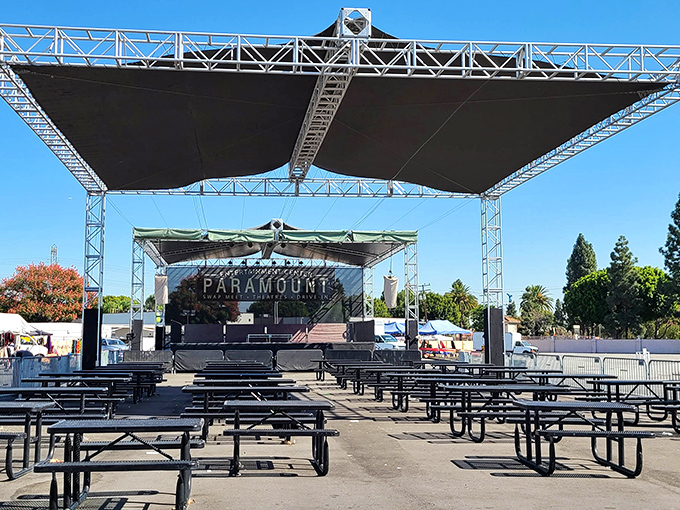 The entertainment area at Paramount Swap Meet offers a shaded respite from bargain hunting, complete with picnic tables for resting weary shopping legs.