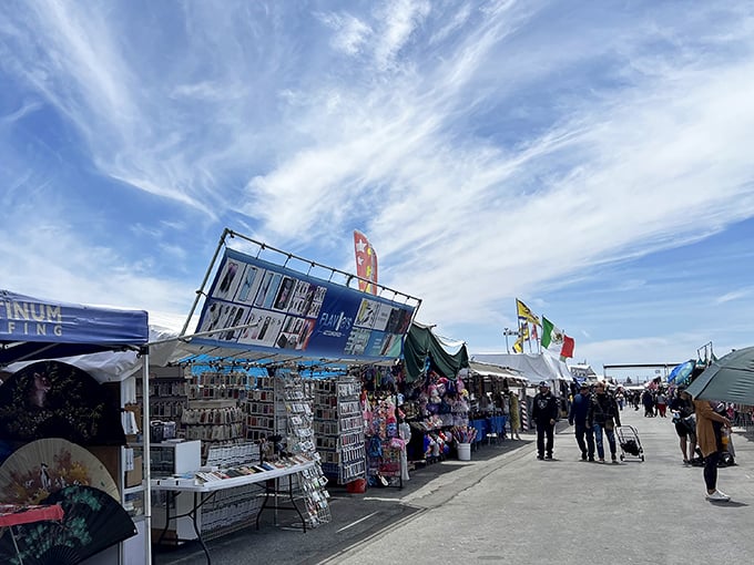 Under this vast canopy, treasure hunters navigate aisles of possibility. The jewelry display gleams with promise while shoppers embark on their bargain safari.