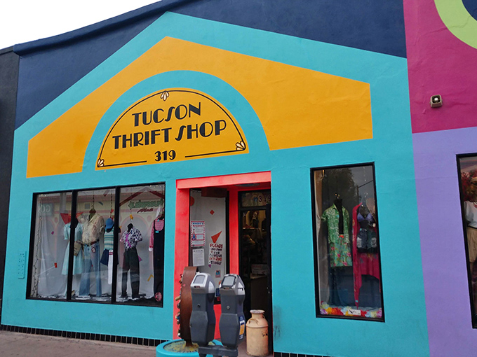 The turquoise facade of Tucson Thrift Shop pops against the desert landscape like a fashion oasis, promising treasures within its vibrant walls.