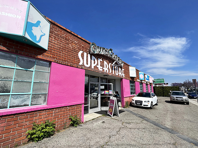 The unmistakable pink-and-brick facade of Out of the Closet stands like a beacon of bargain possibilities in Glassell Park's urban landscape.