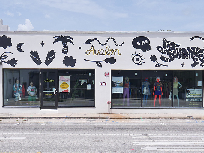 Avalon Exchange's eye-catching storefront beckons with playful black illustrations and gold lettering. Fashion paradise awaits behind those glass doors.