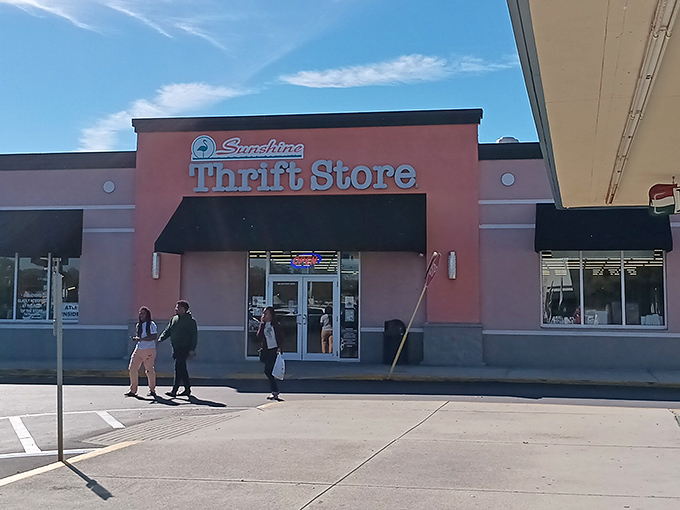 The coral-pink facade of Sunshine Thrift Store beckons like a siren call to bargain hunters across St. Petersburg. Resistance is futile!