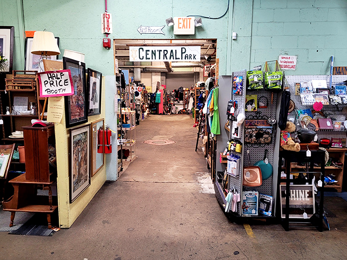The furniture section at Joey's Thrift Mall stands proudly under Old Glory, where patriotism meets bargain hunting in a treasure hunter's paradise.