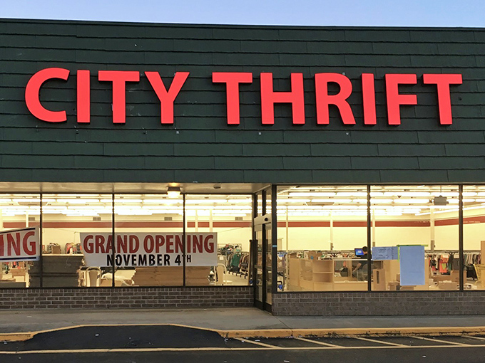 The bold red letters of City Thrift stand out like a beacon of bargain hope against the dark exterior, promising treasures within.