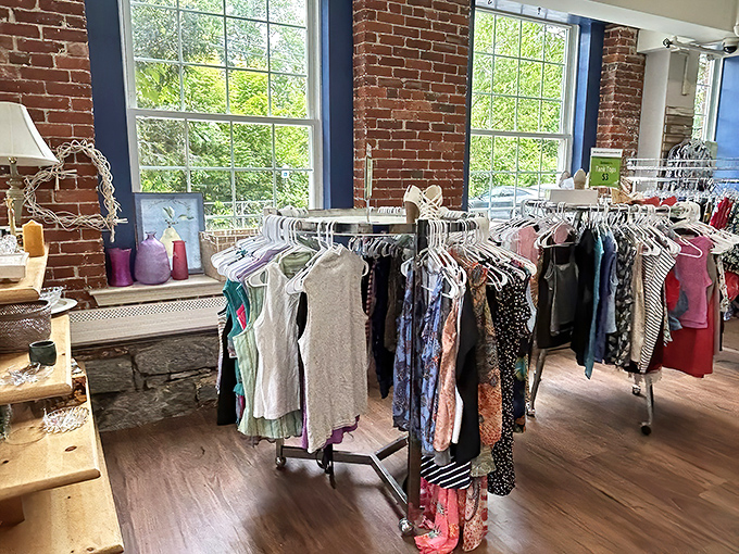 The iconic blue door of Outfitters Thrift Store beckons bargain hunters to this brick building treasure trove in Manchester, where wallet-friendly wonders await.