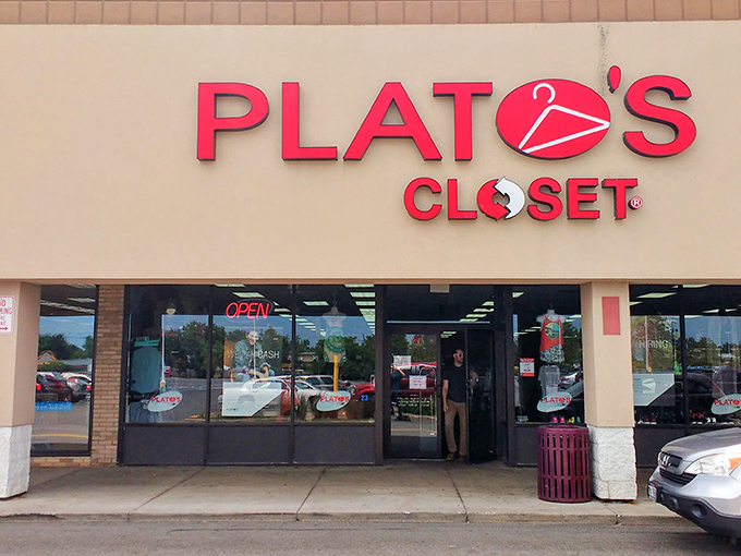 The iconic red Plato's Closet sign welcomes bargain hunters to Rochester's fashion treasure trove where $35 works miracles.