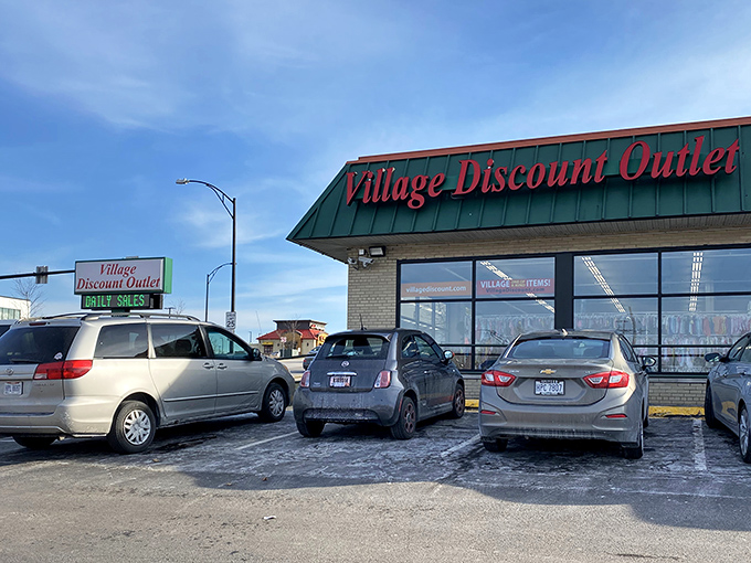 The iconic green roof and red signage of Village Discount Outlet&mdash;retail's version of finding money in your winter coat pocket.