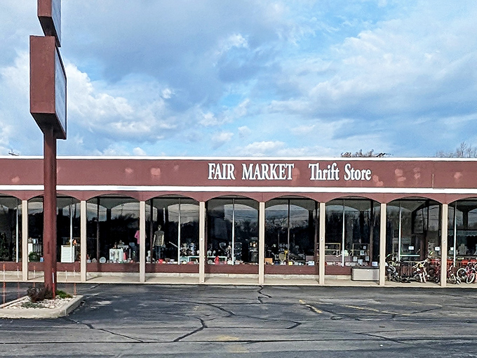 The unassuming storefront of Fair Market Thrift Store beckons with the promise of hidden treasures behind those large windows. Bicycles parked outside hint at local loyalty.