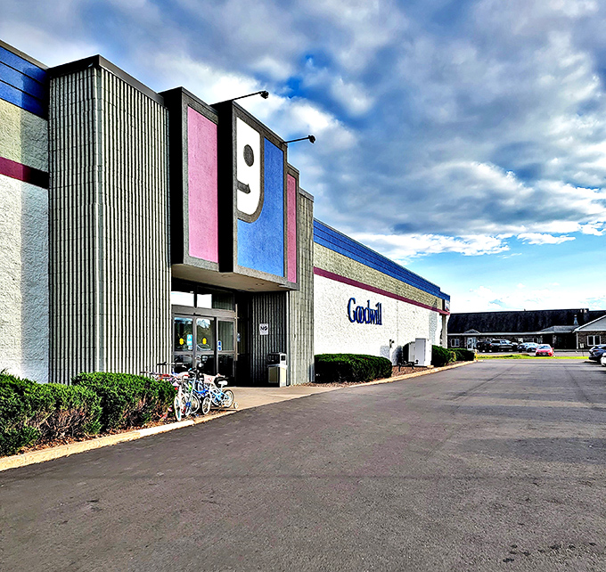 The bright blue exterior of Goodwill sets the stage for bargain hunting, where savvy Wisconsin shoppers with champagne taste and beer budgets uncover fashion treasures inside.