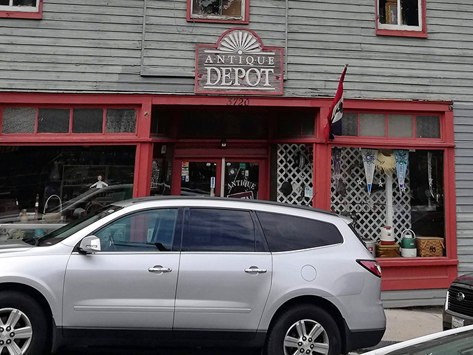 The weathered green clapboard with bright red trim makes the Antique Depot stand out like a vintage postcard come to life in Ellicott City.