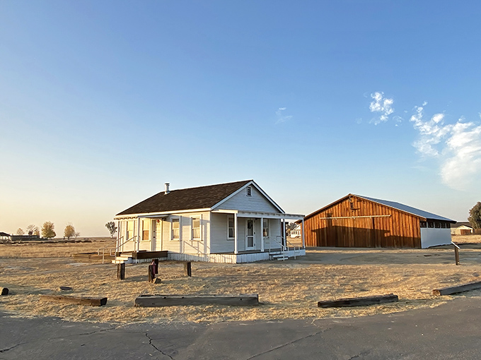 White clapboard buildings stand sentinel against the vast Central Valley sky, telling a story of ambition, hope, and determination in California's historic African American township.