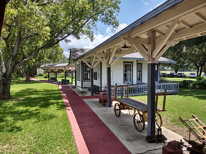 The Trilby Depot welcomes visitors with its pristine white clapboard and shaded porch, a refreshing first stop on your journey through Florida's past.