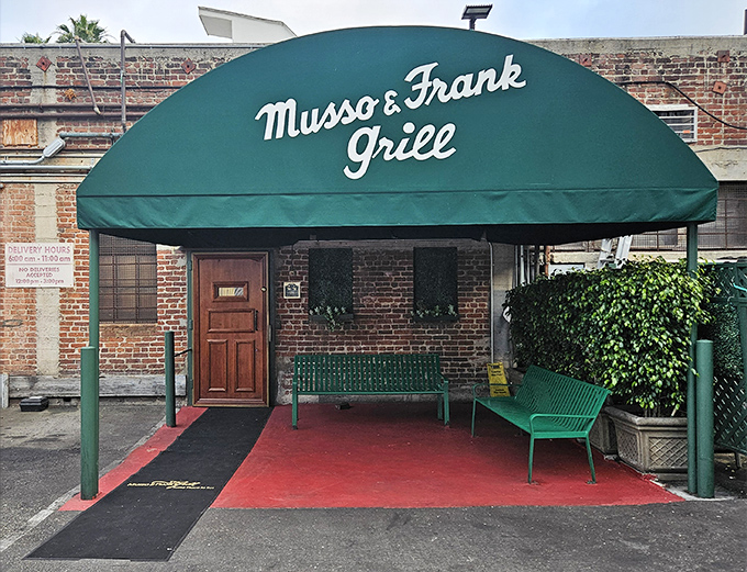 The iconic green awning welcomes you like an old friend. Hollywood history begins at this unassuming entrance where legends have dined for generations.