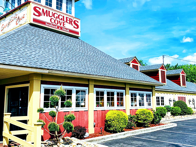 The cheerful red and yellow exterior of Smuggler's Cove stands like a beacon of culinary promise in Tannersville, welcoming hungry travelers with nautical charm.